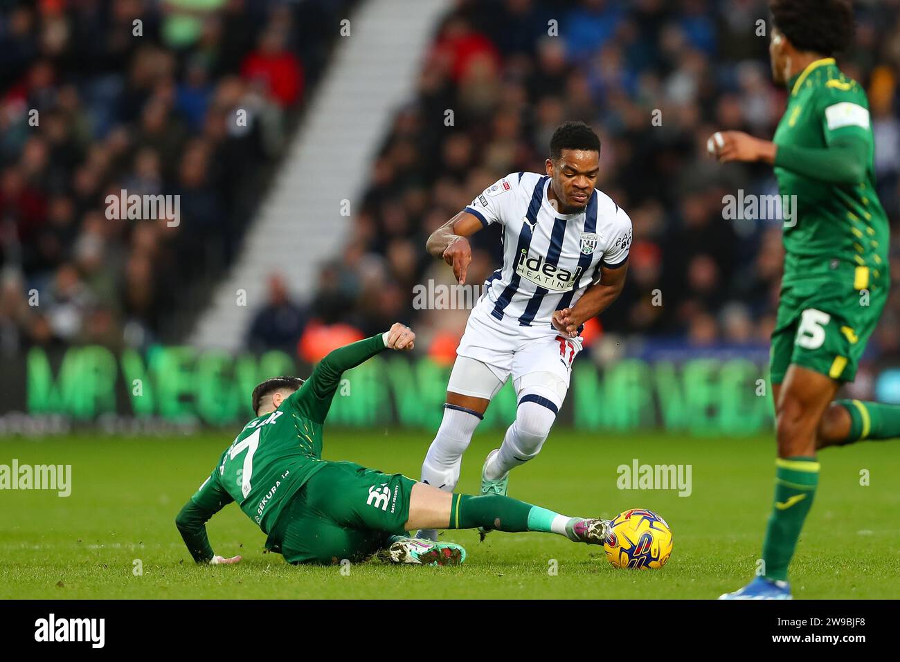 Grady Diangana of West Bromwich battles for possession with Borja Sainz ...