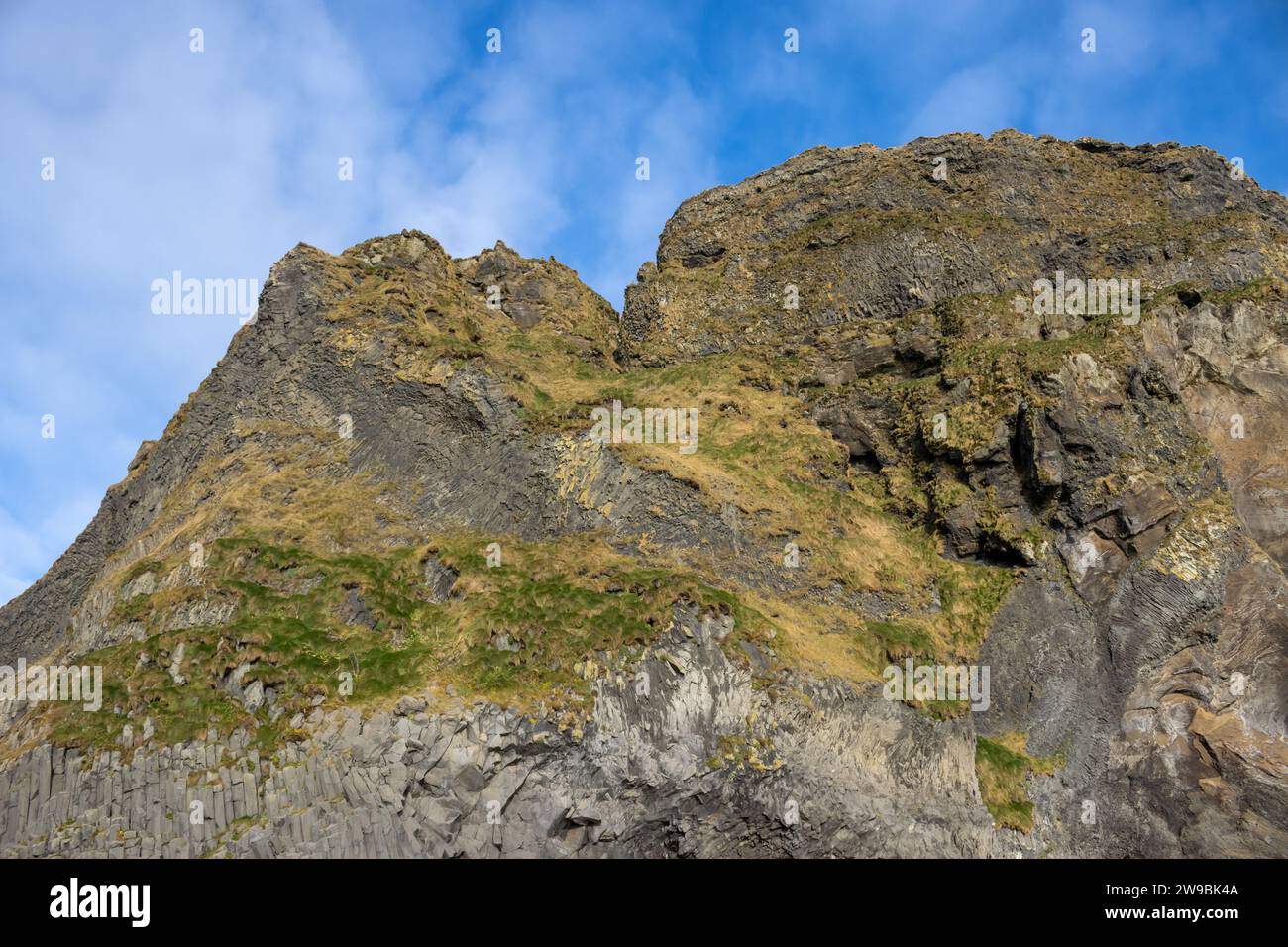 Detail of a mountain with a cave, located on a beach. Fascinating ...