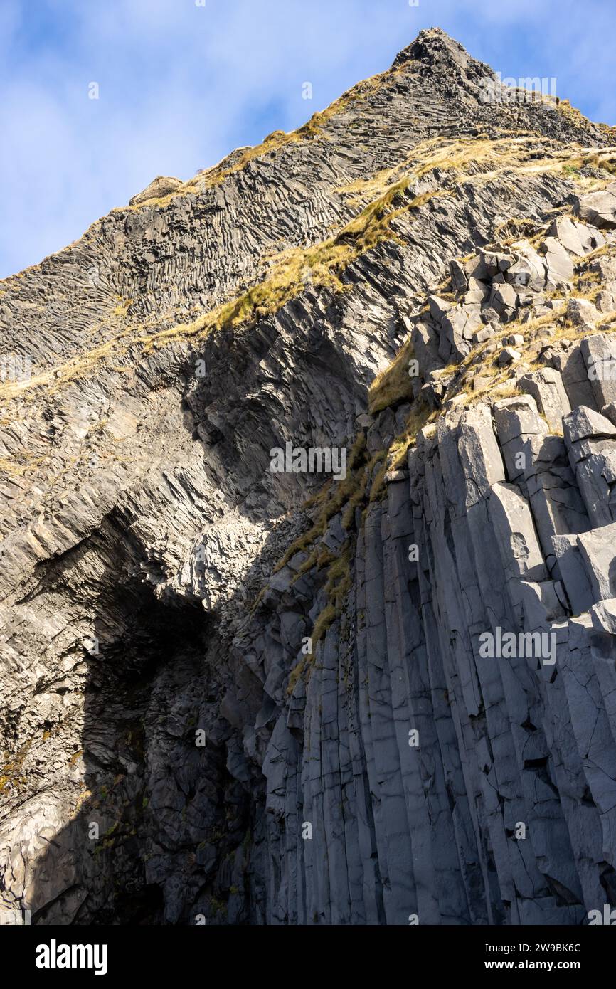 Detail of a mountain with a cave, located on a beach. Fascinating ...