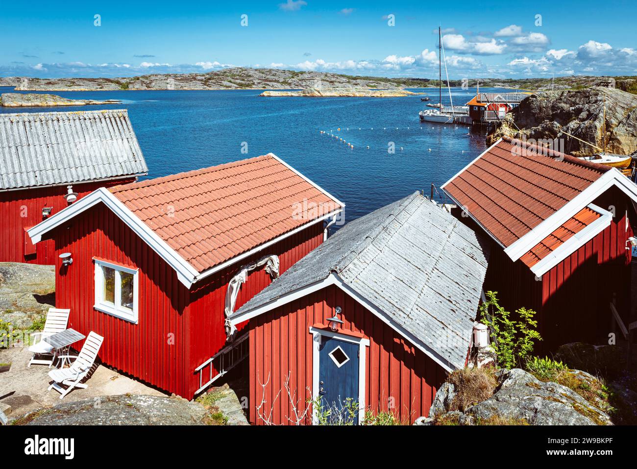Traditional red Swedish wooden huts in front of the bathing place in ...