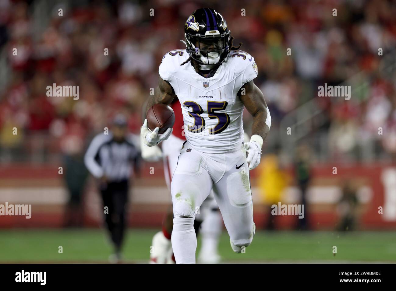 Baltimore Ravens running back Gus Edwards (35) runs against the San ...