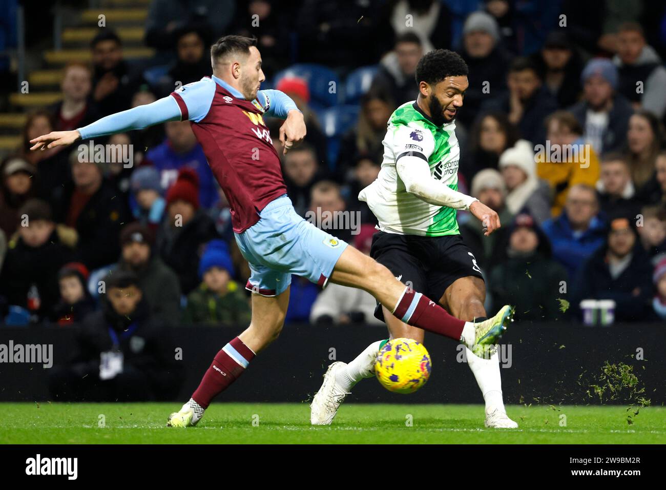 Liverpool's Joe Gomez (right) and Burnley's Josh Brownhill battle for ...