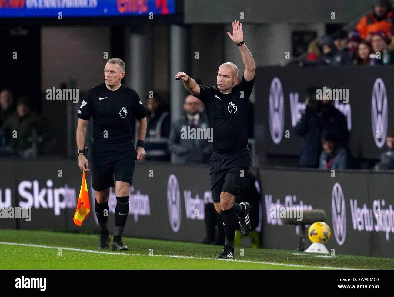 Referee Paul Tierney (right) signals offside after consulting VAR and ...
