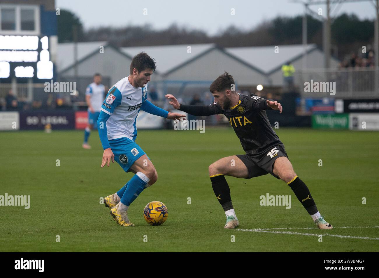 Barrow's Kian Spence in action with Stockport County's Ethan Pye during ...