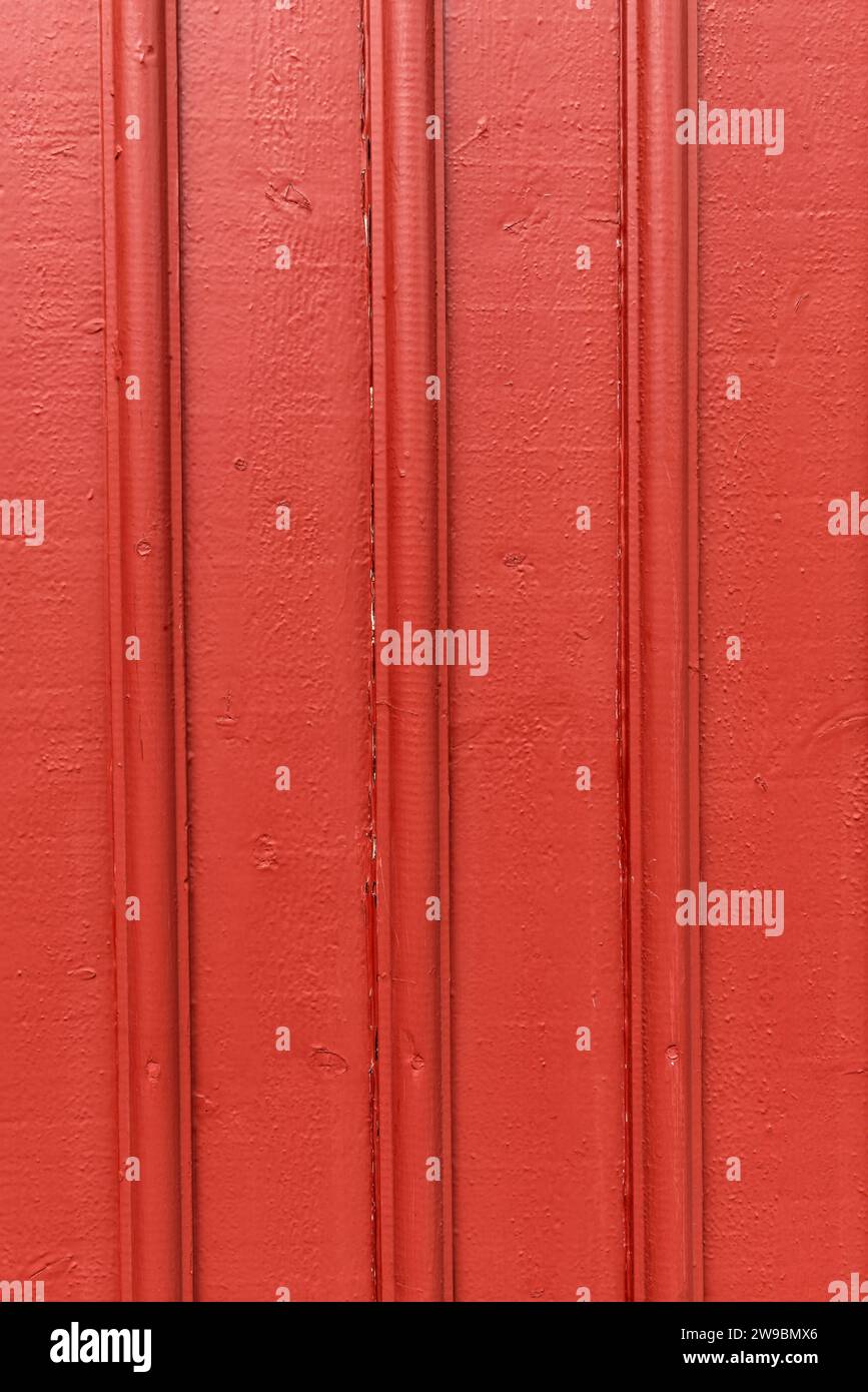 Red painted boards of a wooden facade of a typical Swedish wooden house ...