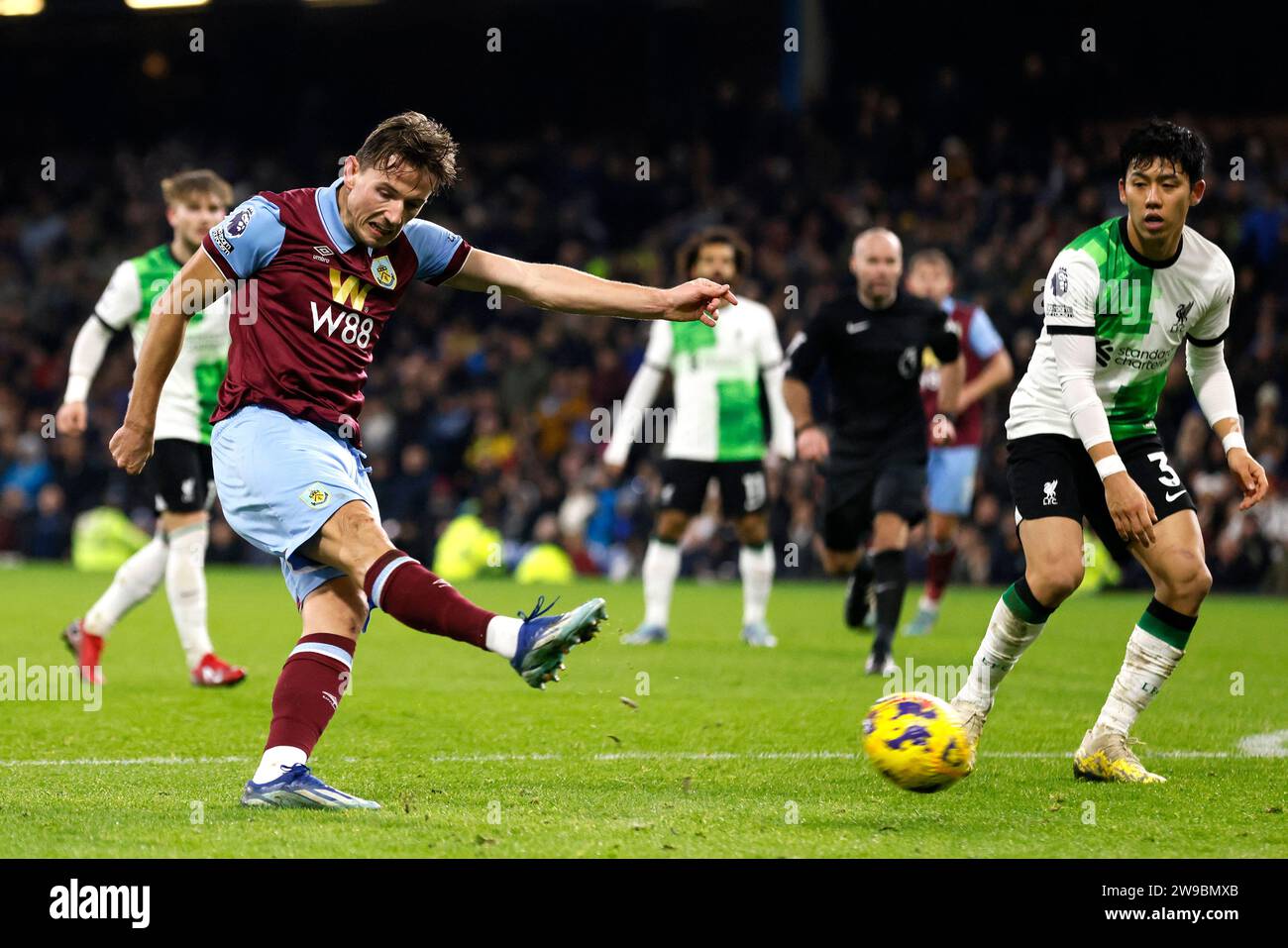Burnley's Sander Berge (left) attempts a shot on goal during the ...