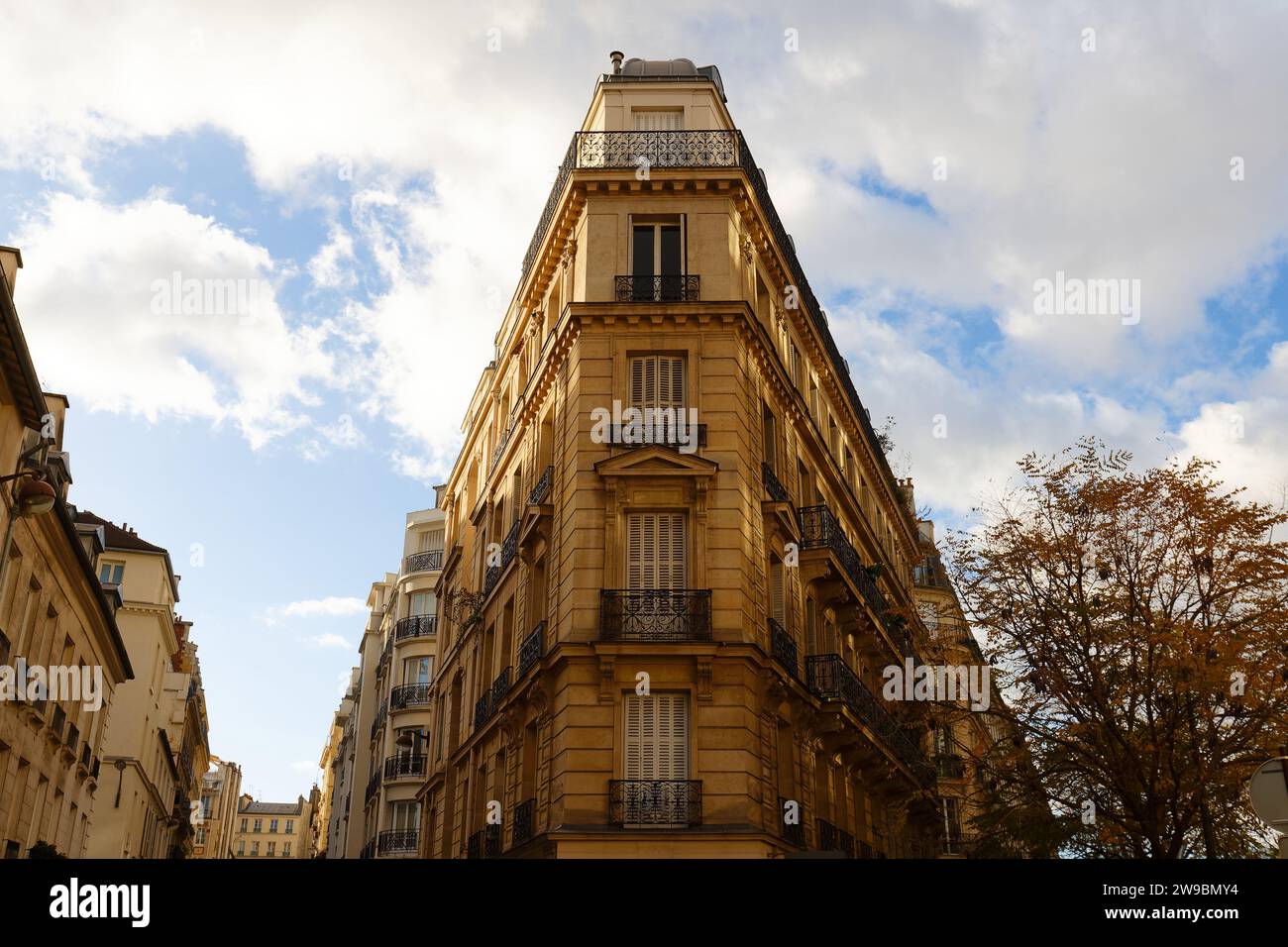 The facade of traditional French house with typical balconies and ...