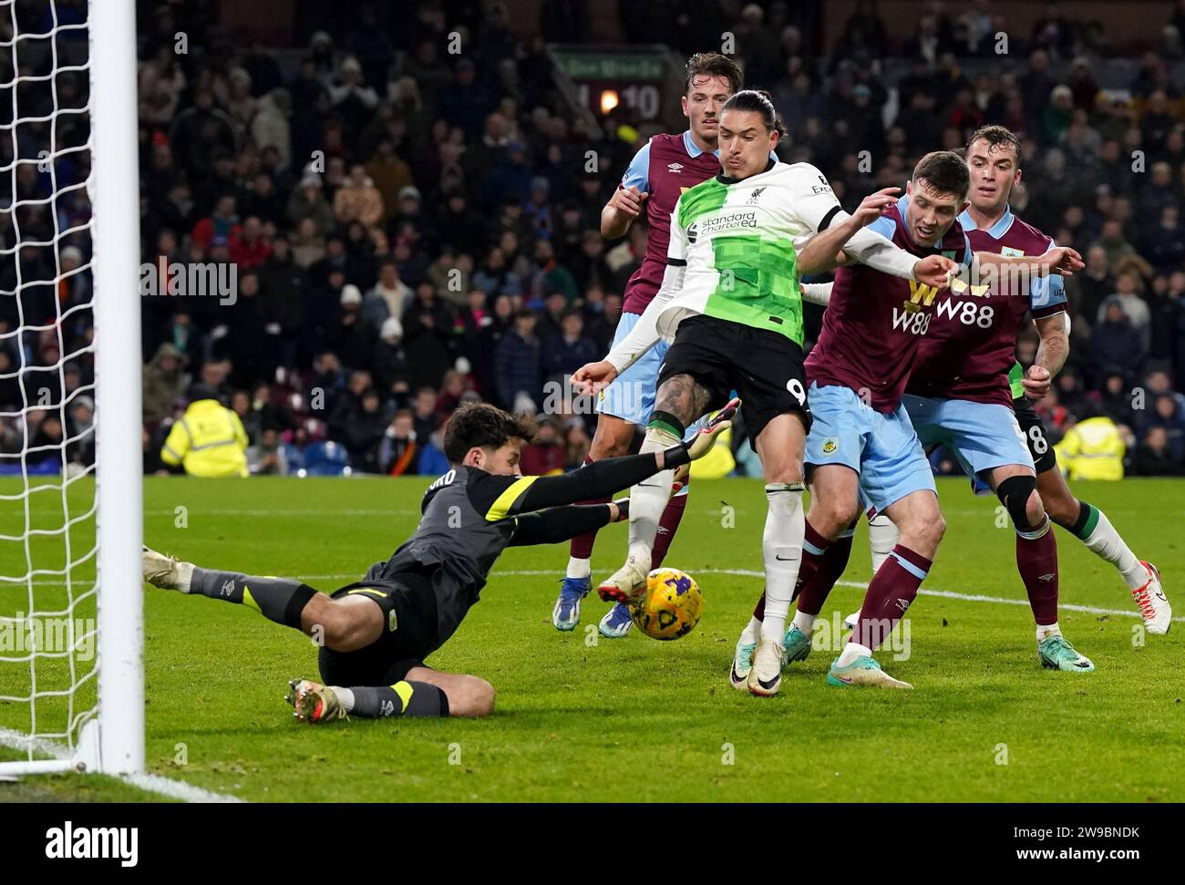 Burnley goalkeeper James Trafford saves at the feet of Liverpool's ...