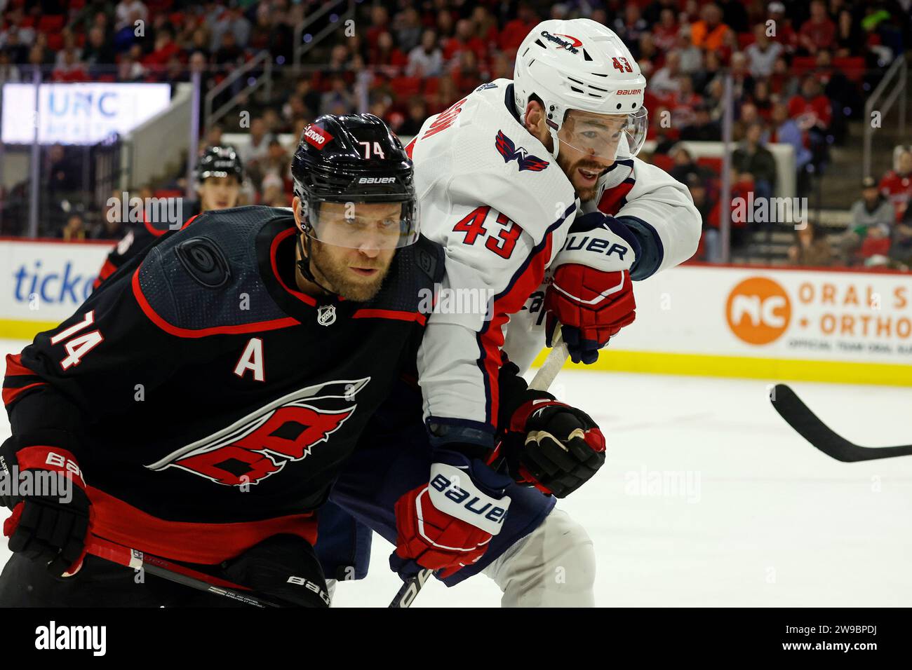 Carolina Hurricanes' Jaccob Slavin (74) tangles with Washington ...