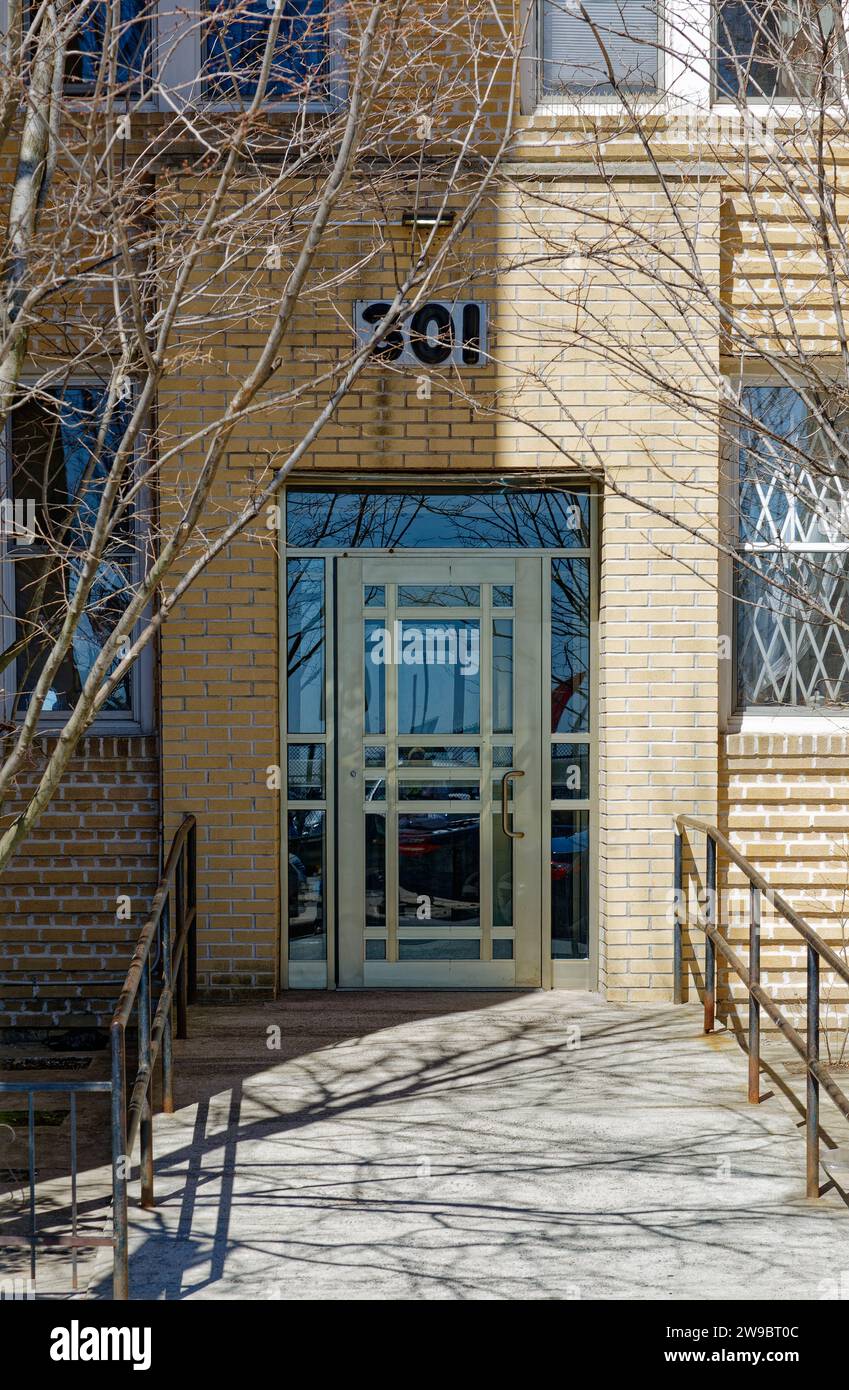 301 Brightwater Court is a blue and grey brick and yellow stucco ...