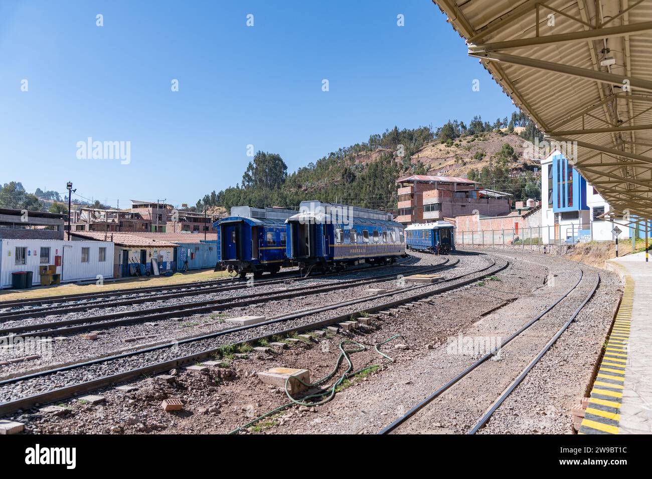 The Perurail train carriage on a railway track at Poroy Station in ...