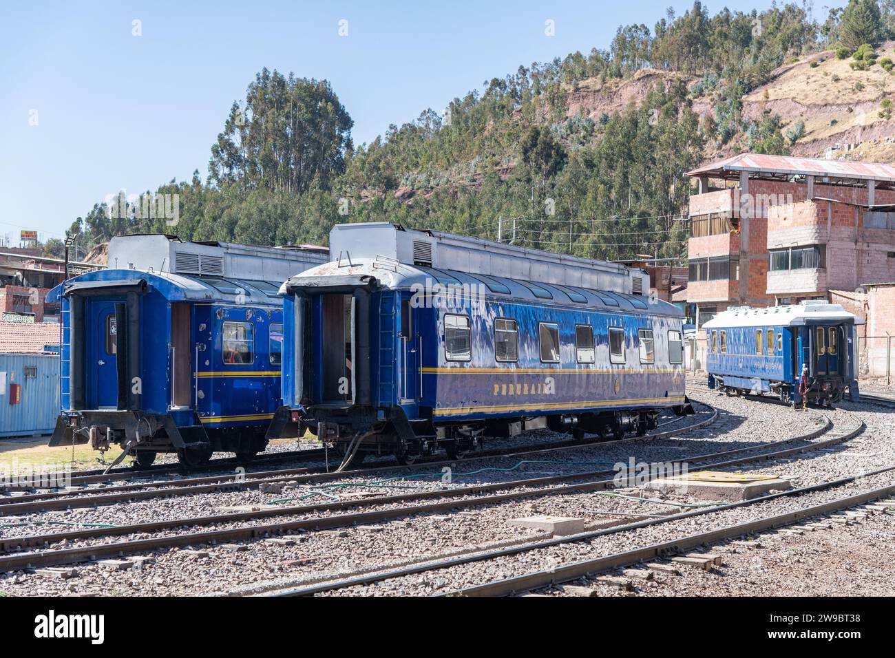 The Perurail train carriage on a railway track at Poroy Station in ...