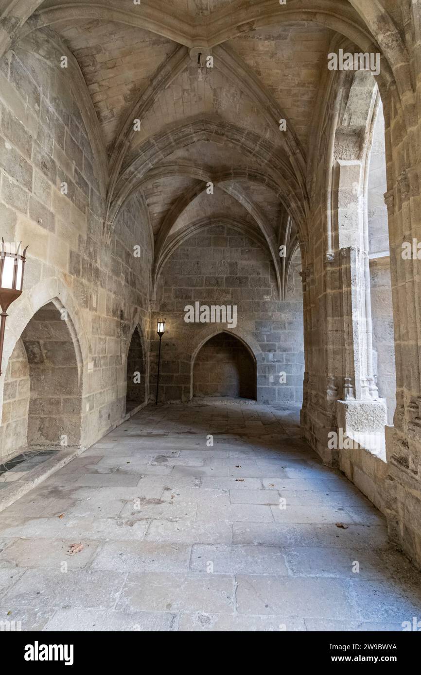 Interior corridor in ancient landmark building with gothic arch in a ...