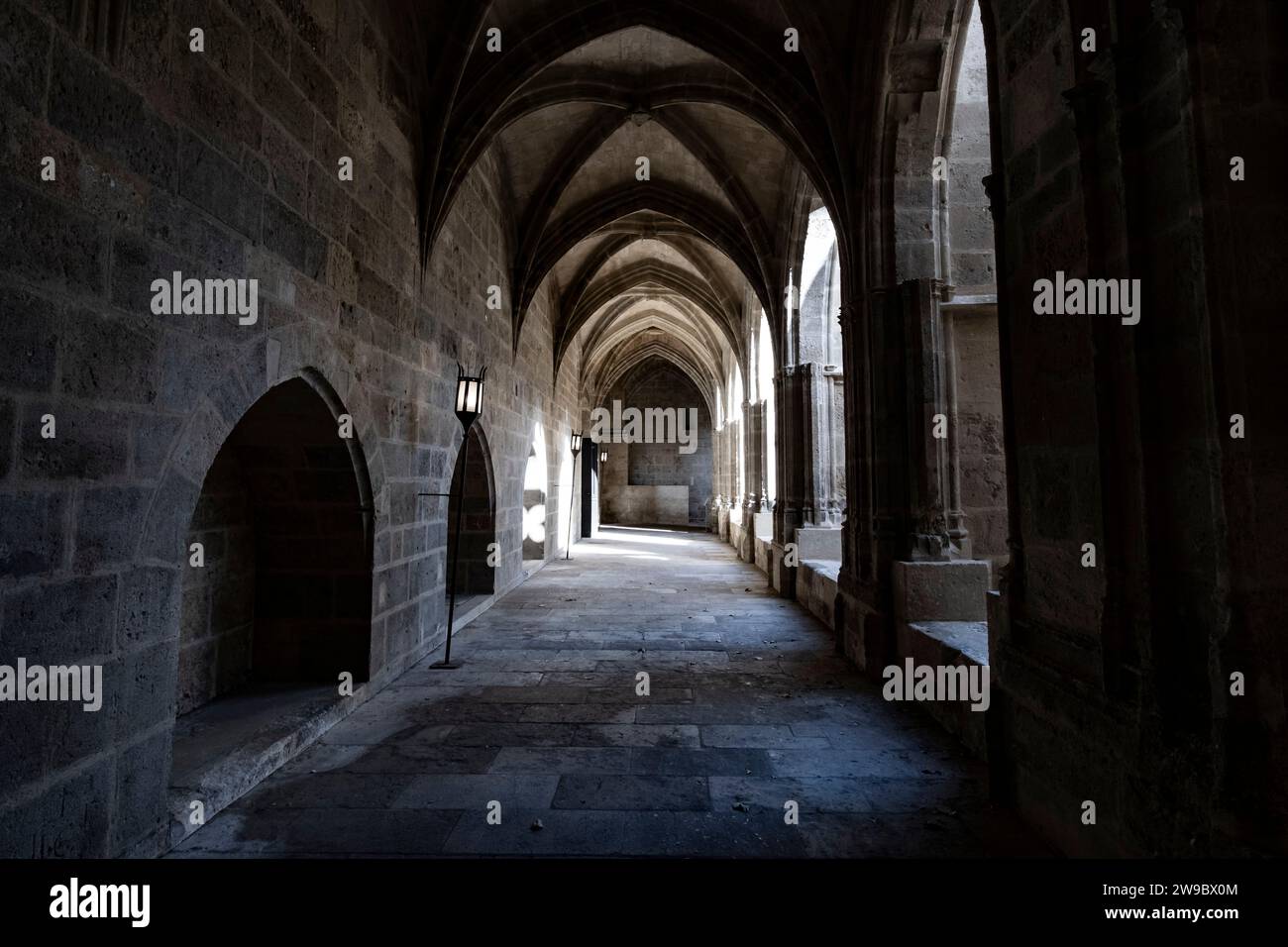 Interior corridor in ancient landmark building with gothic arch in a ...