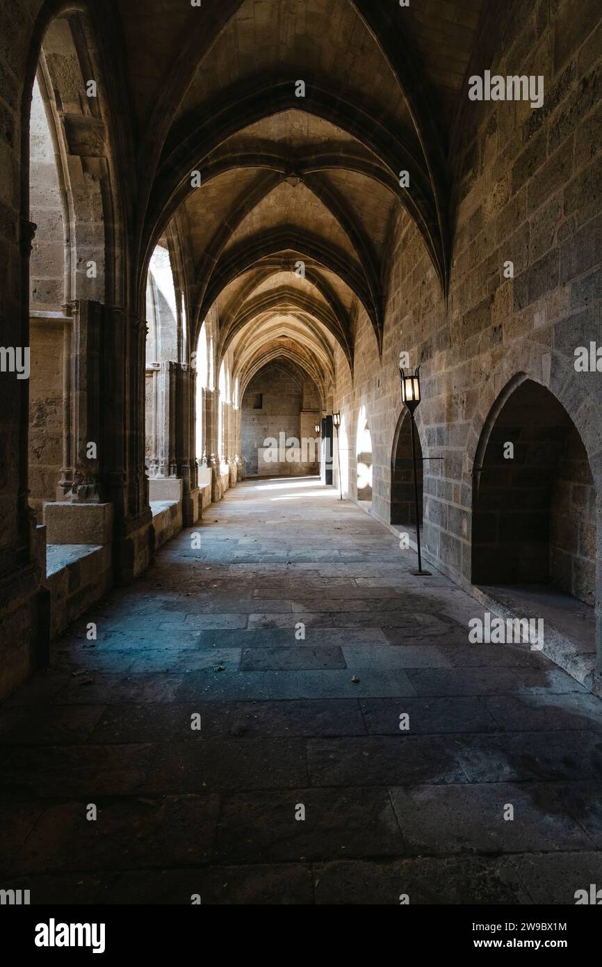 Interior corridor in ancient landmark building with gothic arch in a ...