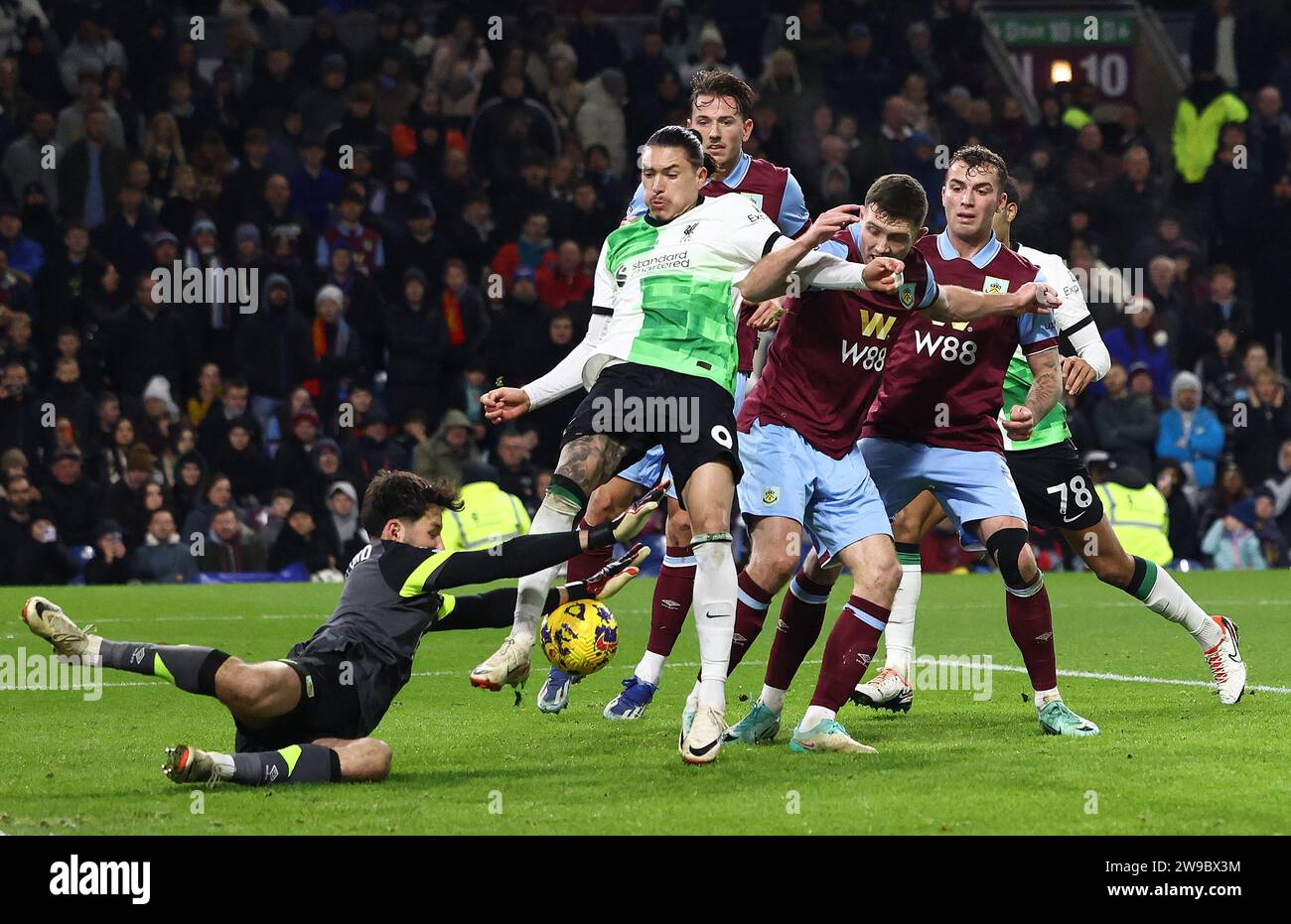 Burnley, UK. 26th Dec, 2023. James Trafford of Burnley (L) saves from ...