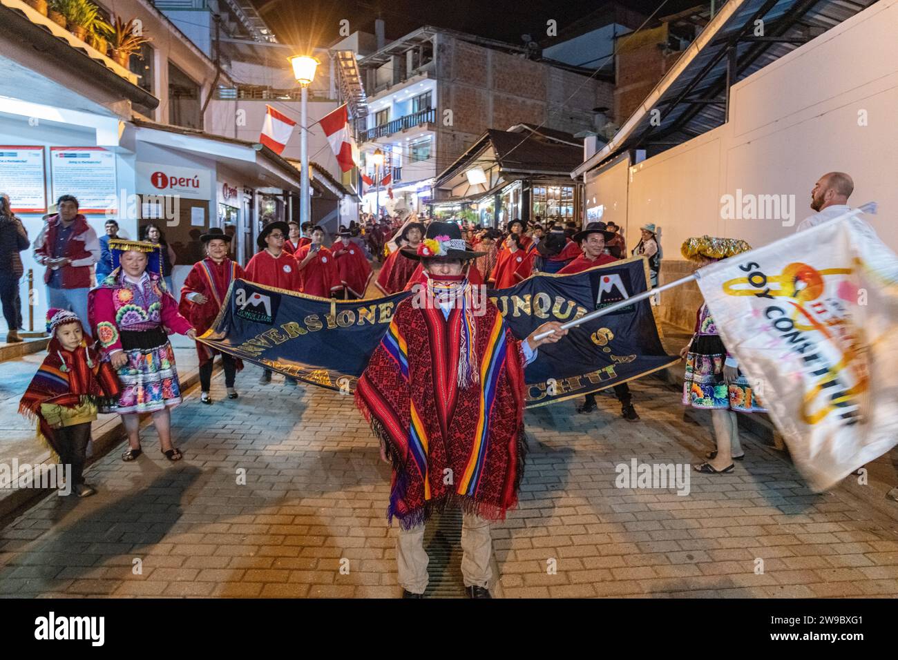 A ceremony procession in Aguas Calientes, Peru, celebrating the ...