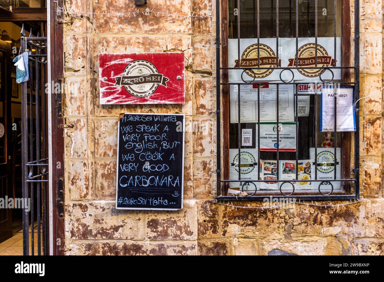 Sign at a restaurant: "We speak very poor English, but we cook a very ...