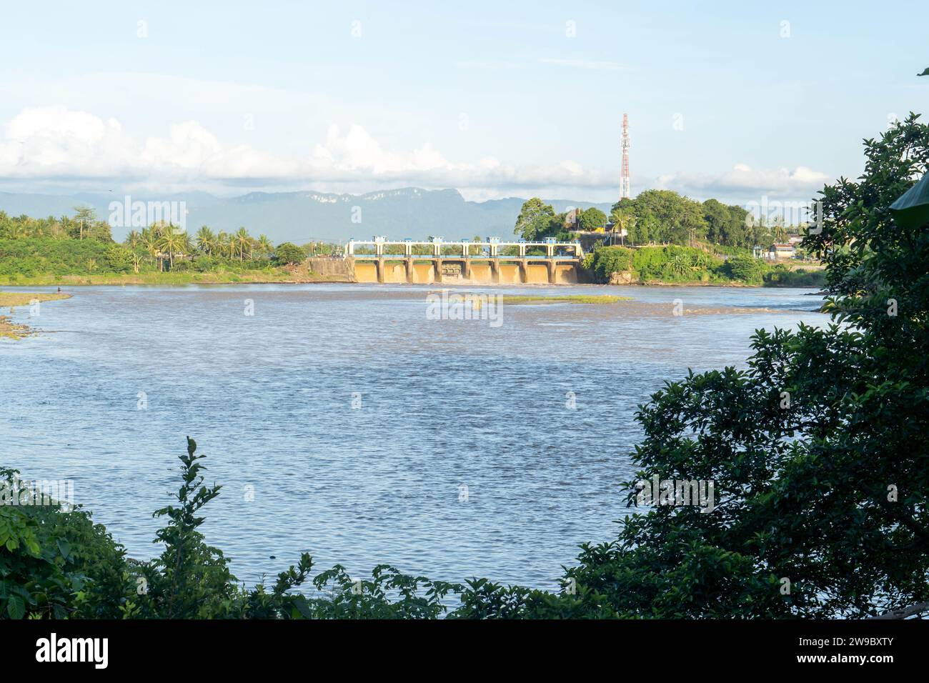 view of an irrigation dam, photographed from a distance, afternoon ...