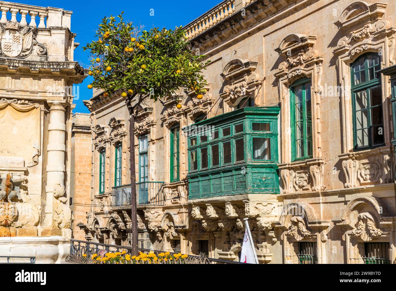 Street view of Valletta with typical balconies on the house facades ...