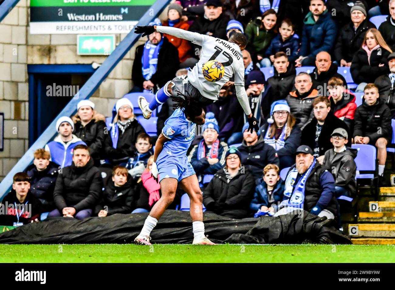 Peter Kioso (30 Peterborough United) challenges Caylan Vickers (12 ...