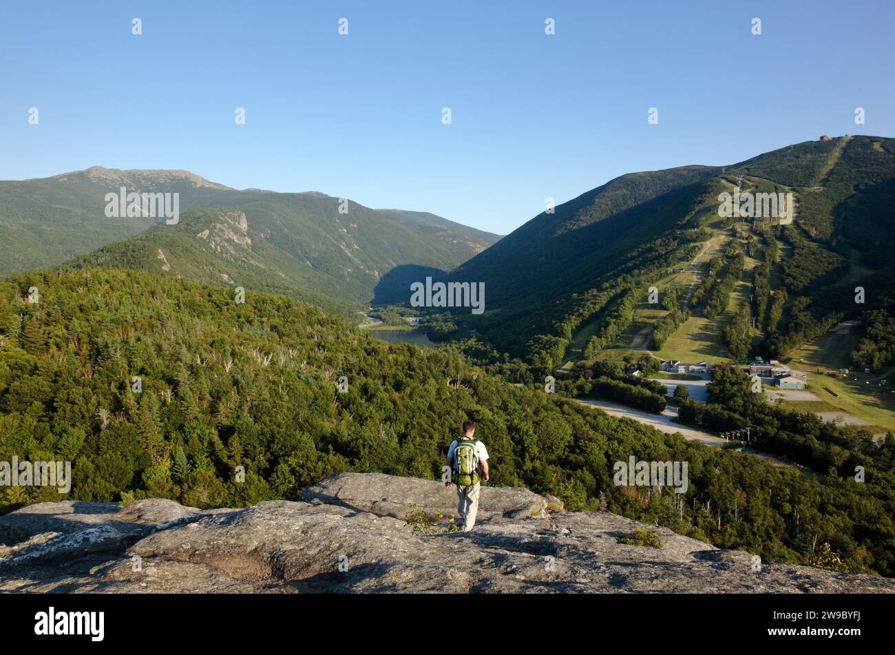 A hiker on the summit of Bald Mountain in the New Hampshire White ...