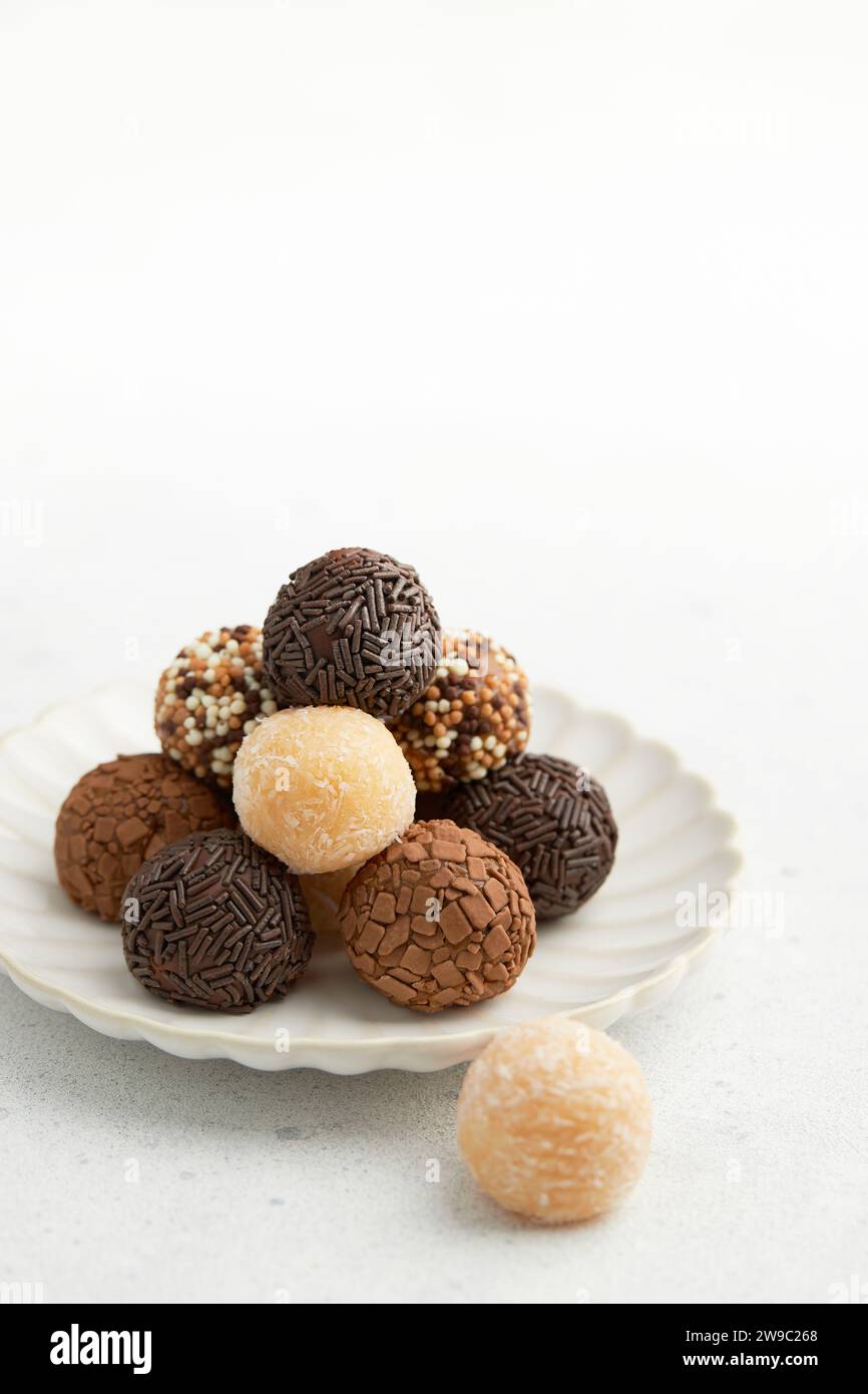 Typical Brazilian sweet brigadeiro. A heap of assorted flavors of ...