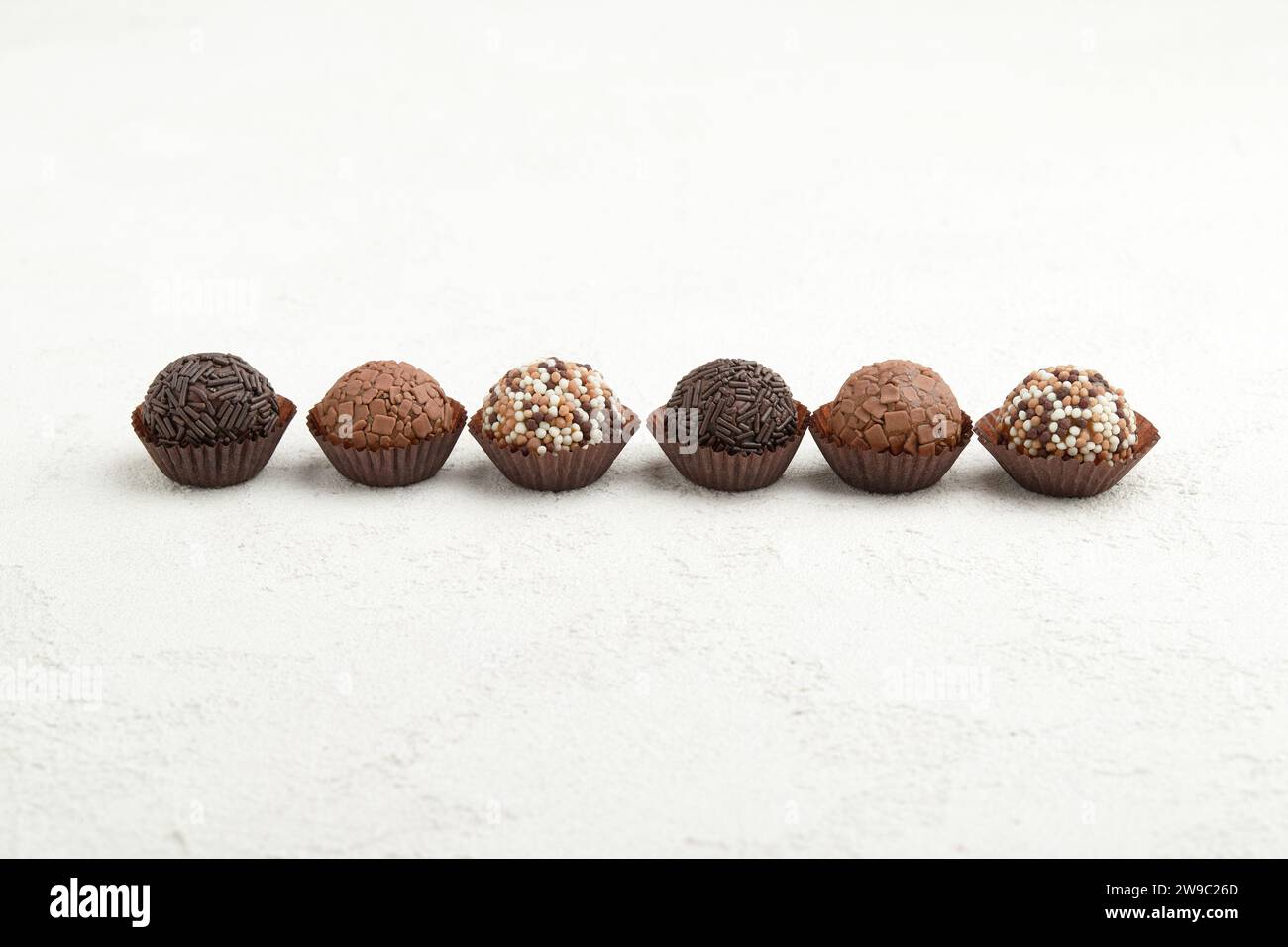 Typical Brazilian sweet brigadeiro. Assorted flavors of candies in a ...