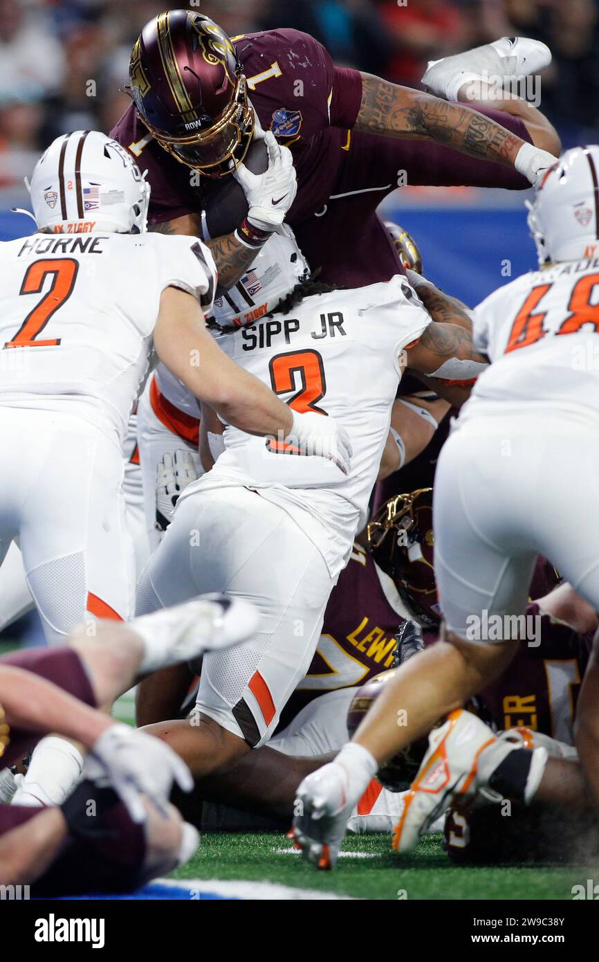 Minnesota running back Darius Taylor (1) leaps over Bowling Green ...