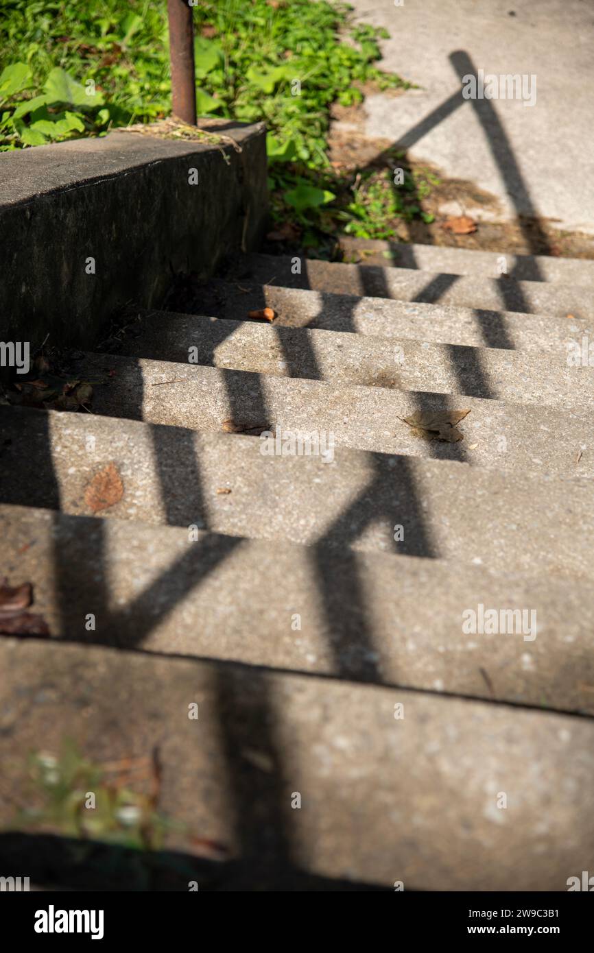 shadows of railing on stone stairs Stock Photo - Alamy
