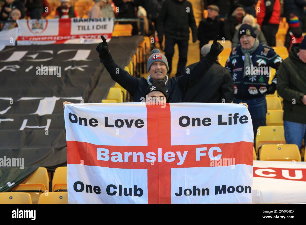 Barnsley fans with a flag during the Sky Bet League 1 match Port Vale ...