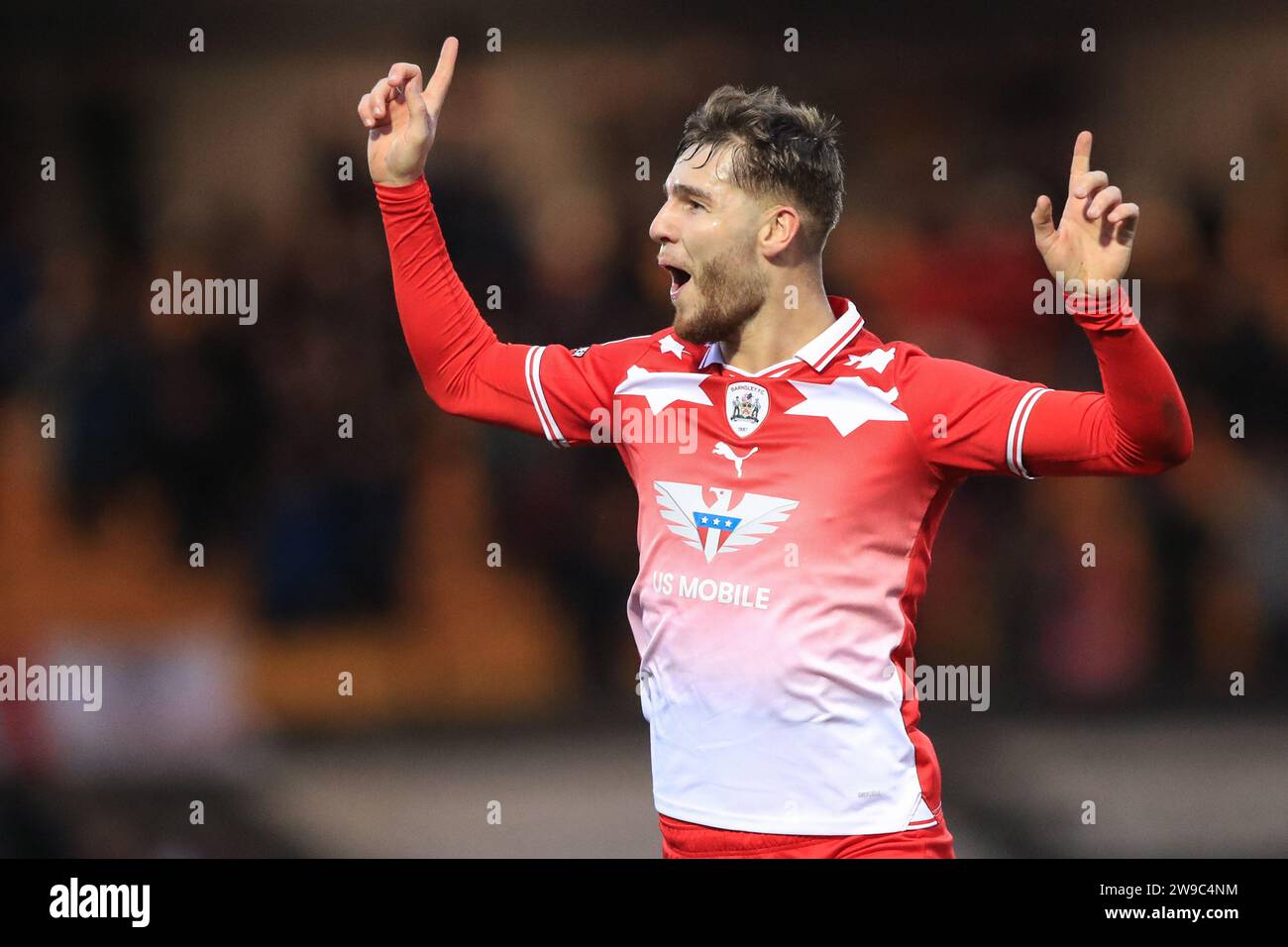 John Mcatee #45 of Barnsley celebrates his goal to make it 3-0 during ...