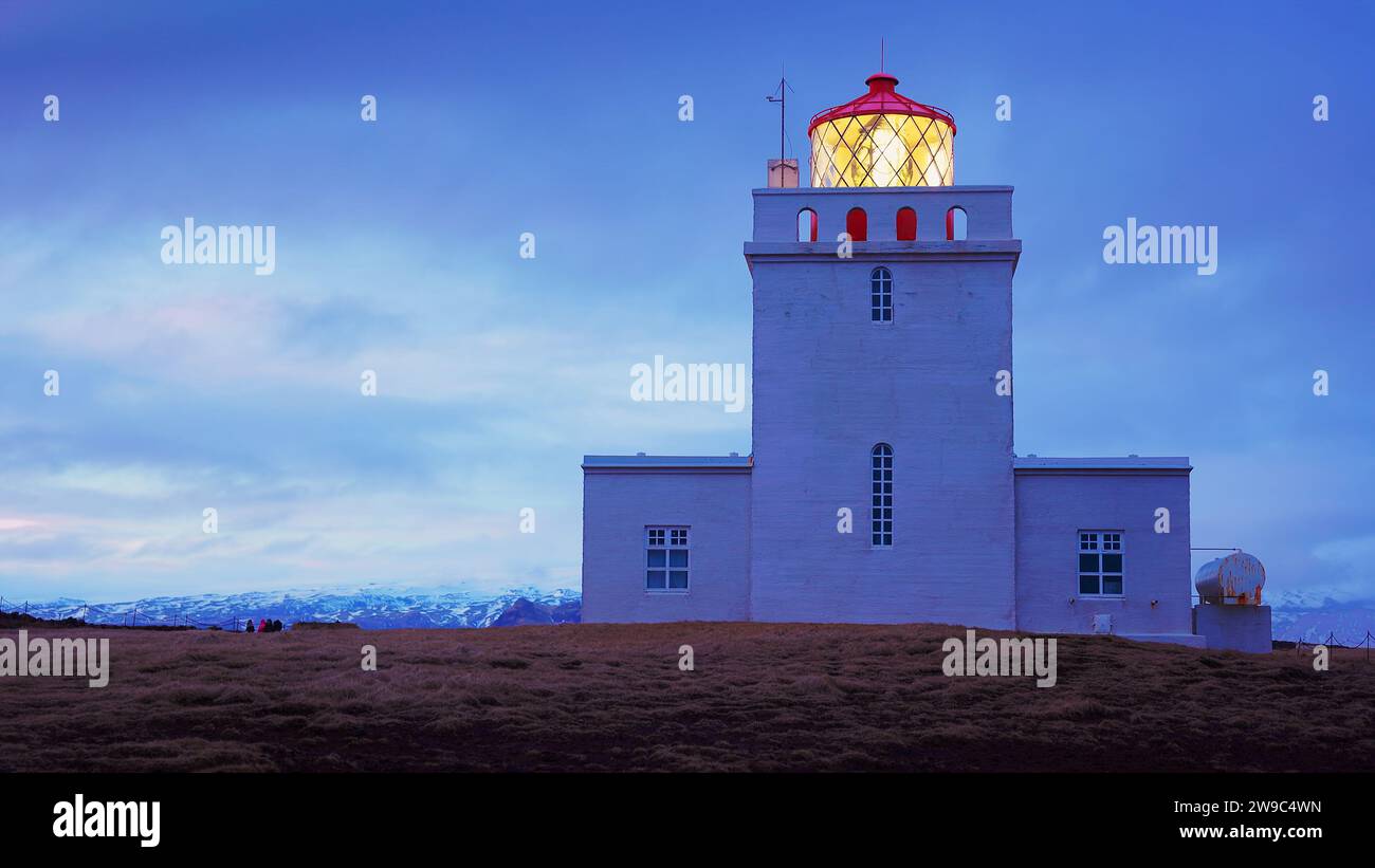 Dyrholaey lighthouse on peninsula circa March 2023 with tall guidance ...