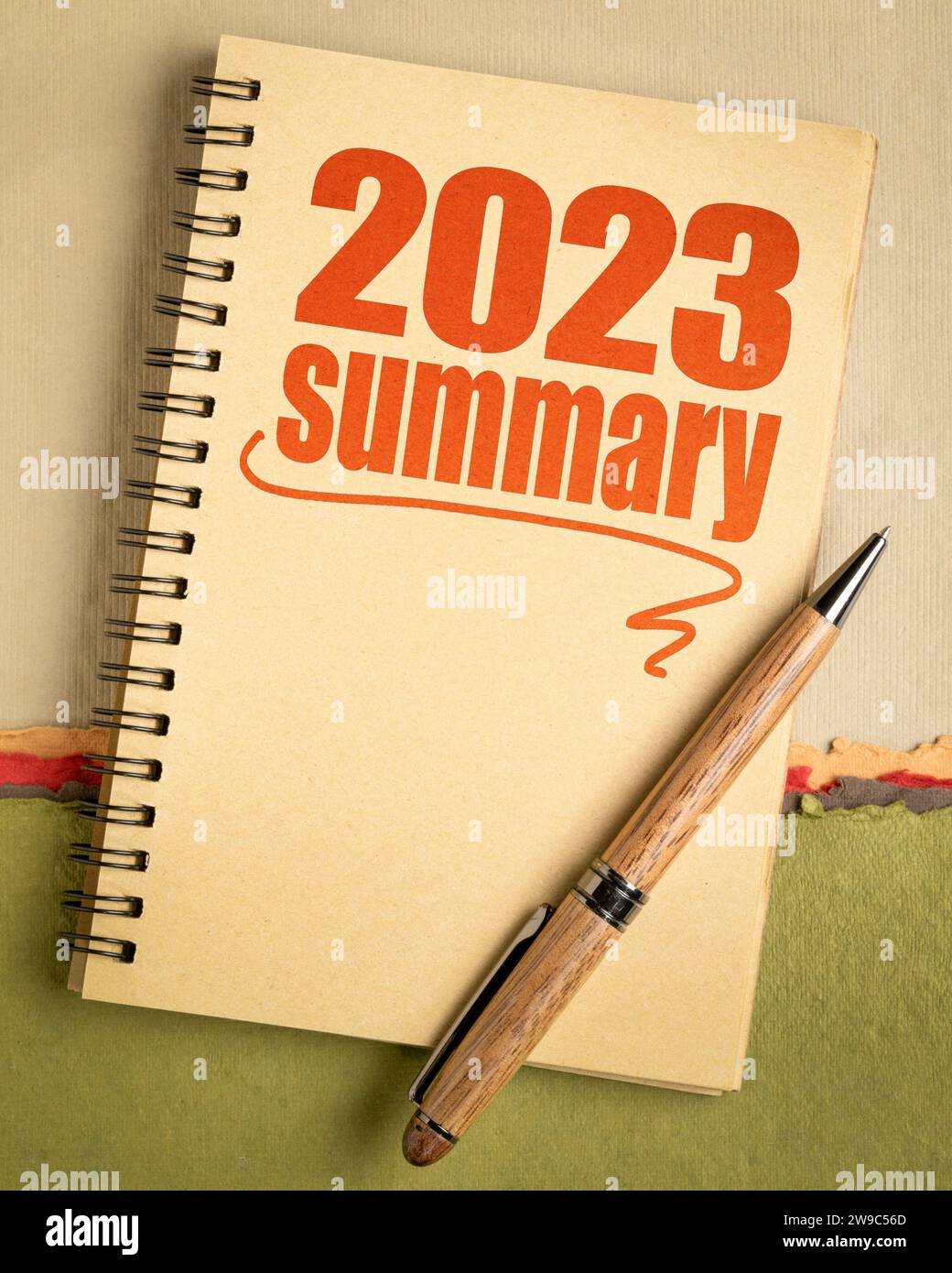 2023 year summary text in a spiral notebook, end of year business ...