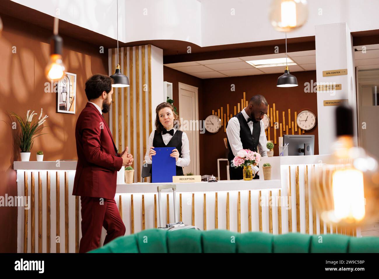 Hotel concierge greet client at reception, providing luxury ...