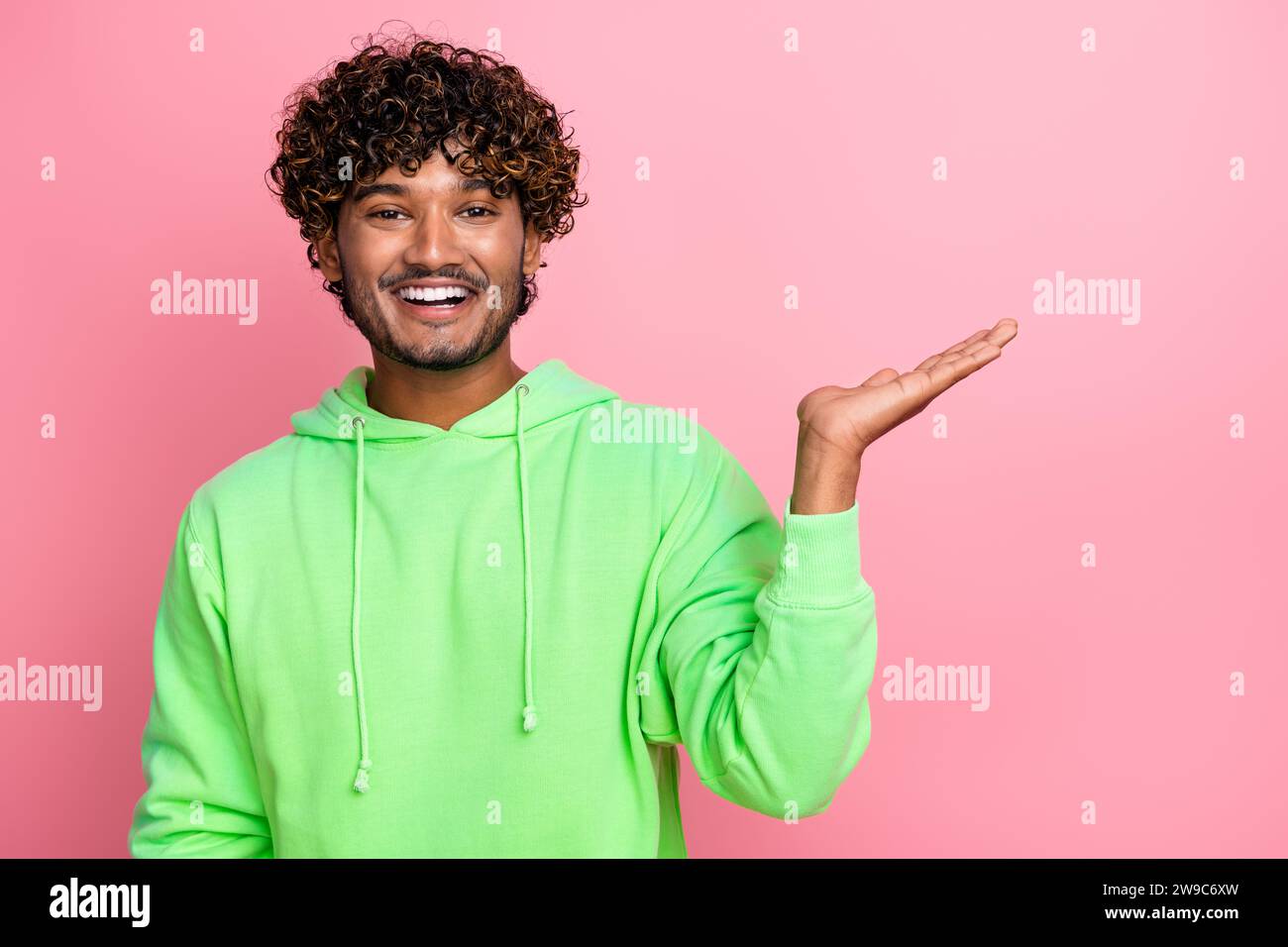 Photo of smiling young arabian curly haired boyfriend holding palm ...