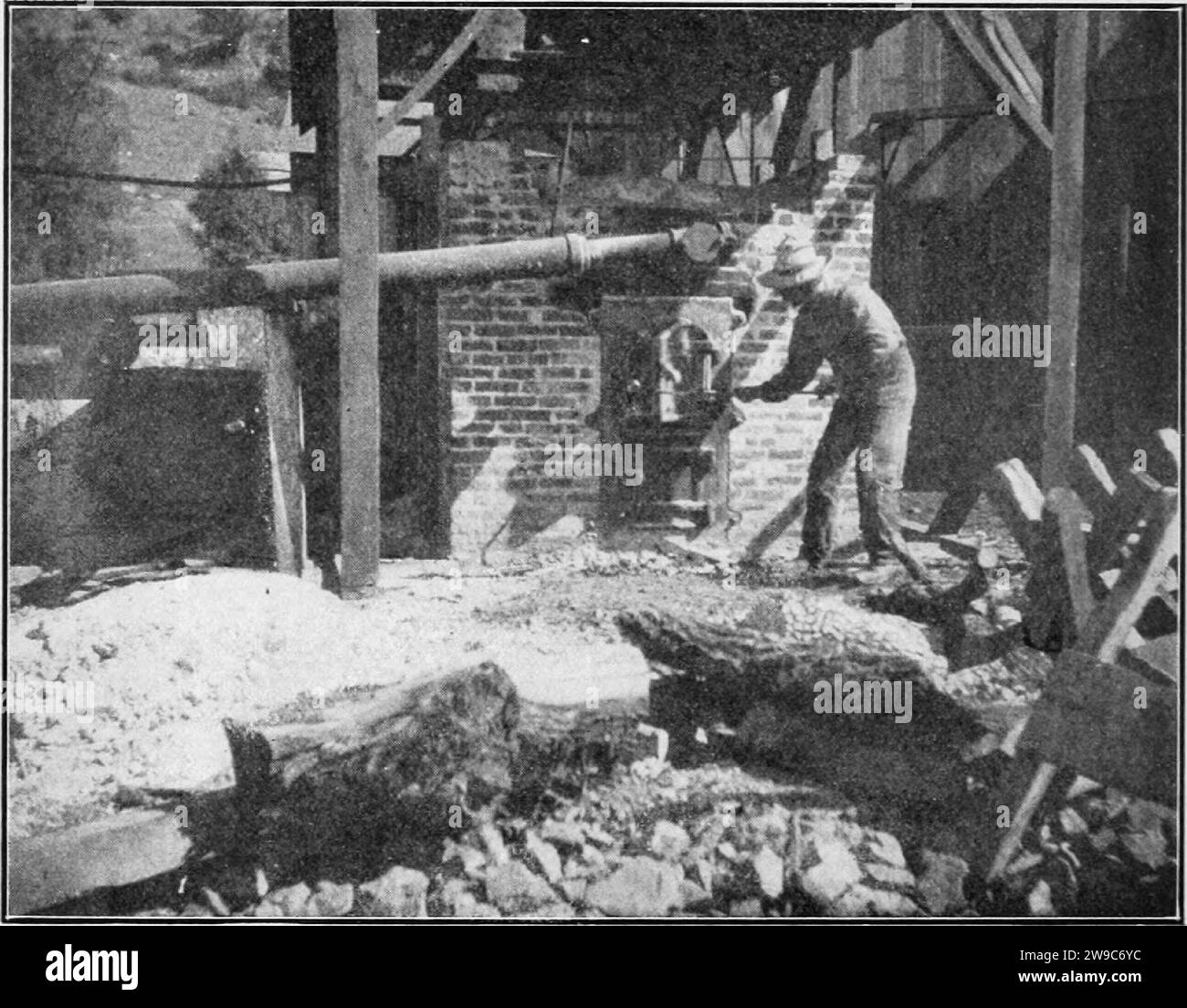 halftone of a man working at smelting furnace of the New Almaden ...
