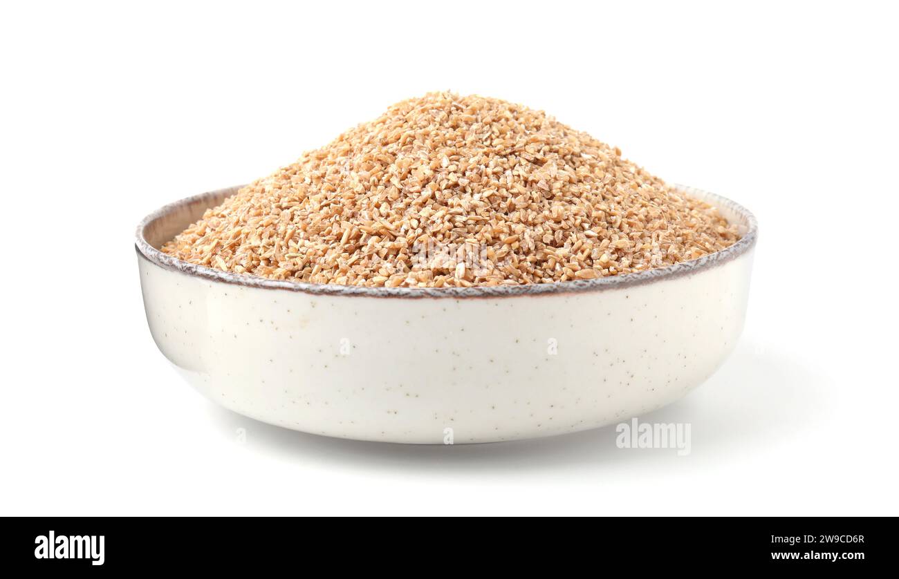 Dry wheat groats in bowl isolated on white Stock Photo - Alamy