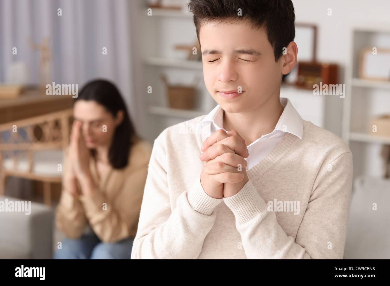 Little boy praying at home, closeup Stock Photo - Alamy