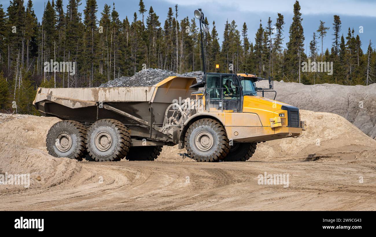 Dump truck transporting a load of stone on a construction site Stock ...