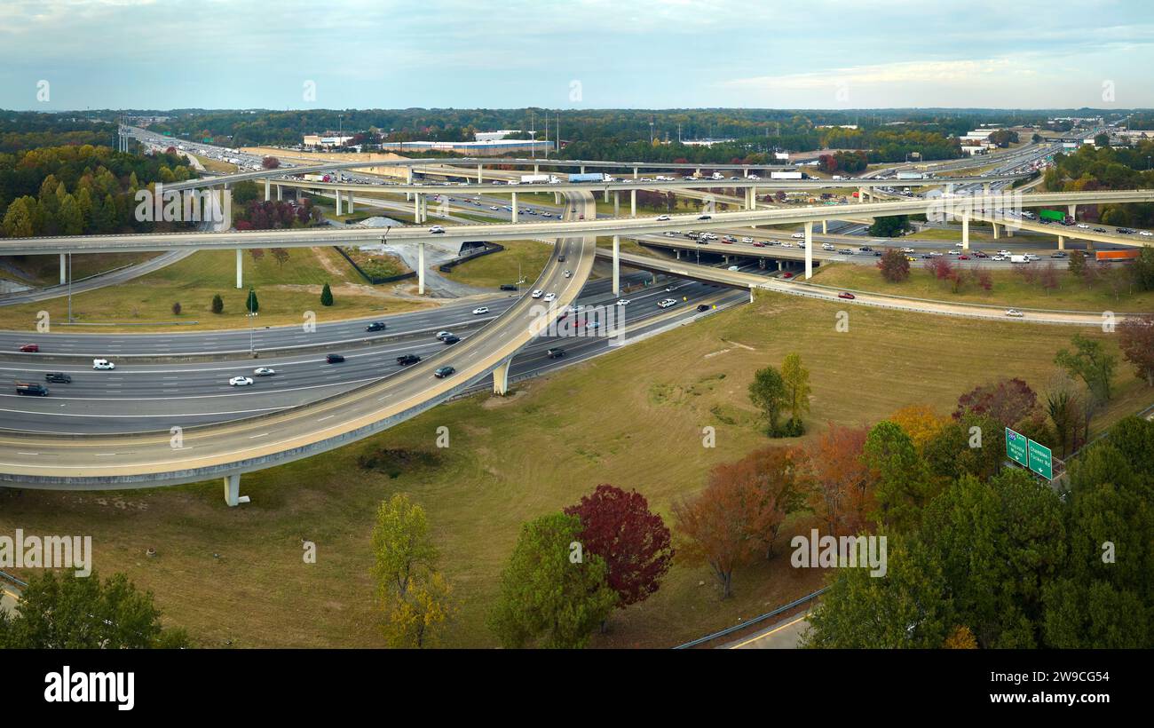 Aerial view of american freeway intersection with fast moving cars and ...
