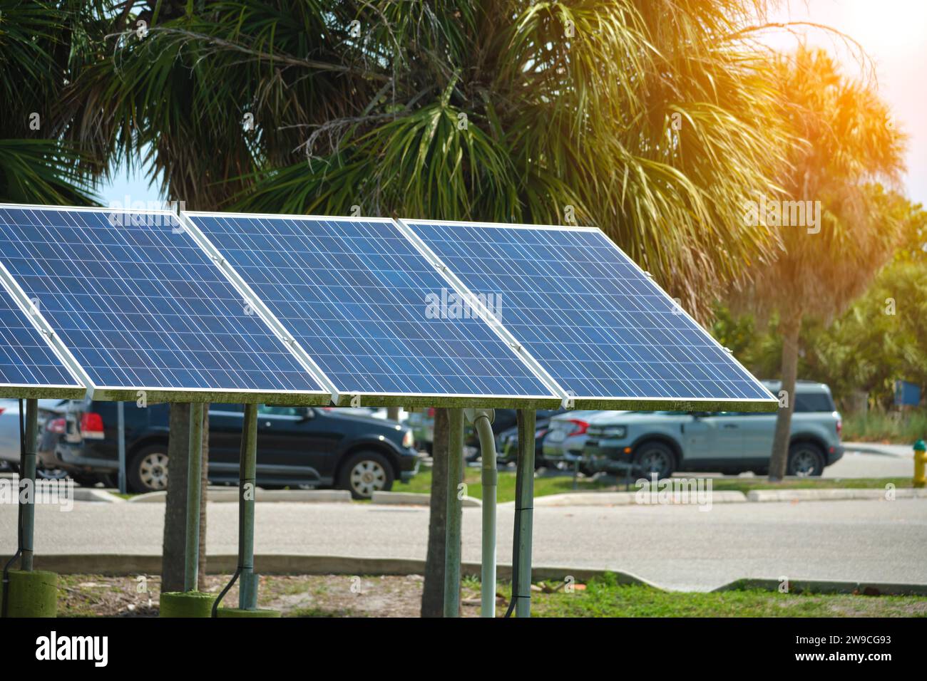 Solar panels installed on stand frame near parking lot for effective ...