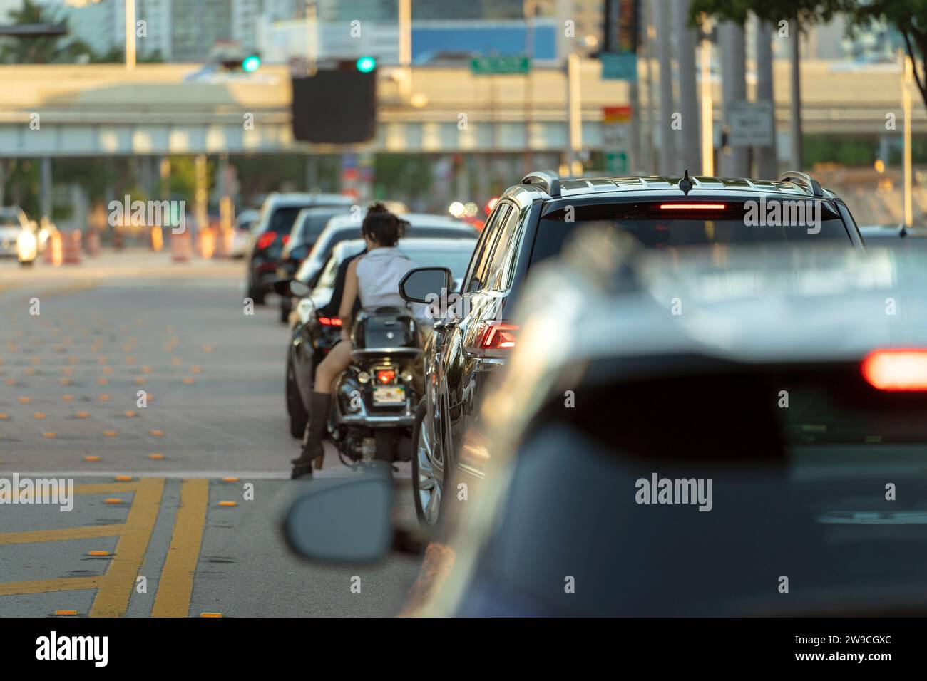 Traffic lights regulating driving cars on city street in Miami, Florida ...