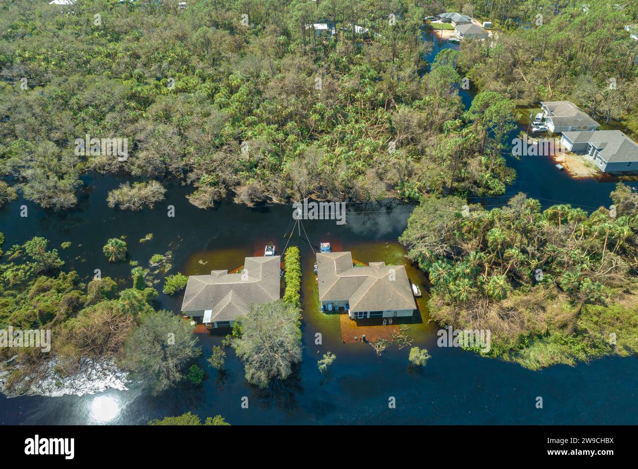 Aftermath of natural disaster. Flooded houses by hurricane Ian rainfall ...