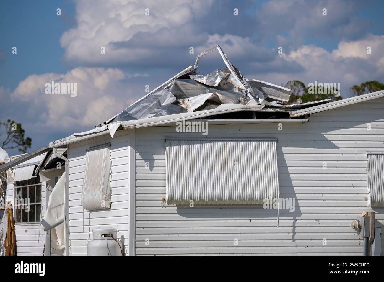 Severely damaged houses after hurricane in Florida mobile home ...