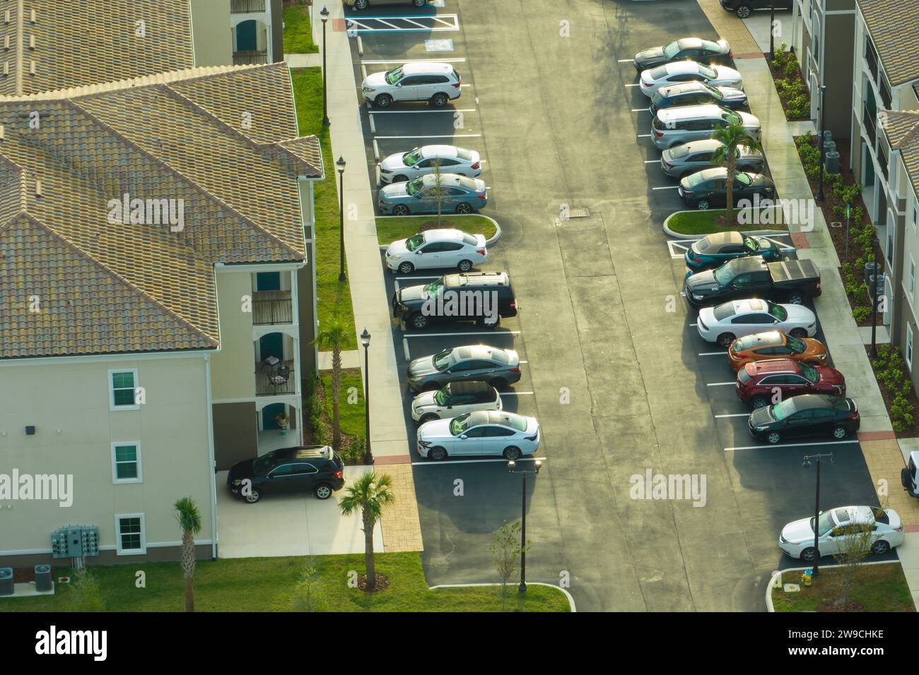 Cars parked on parking place of new apartment condos in Florida ...