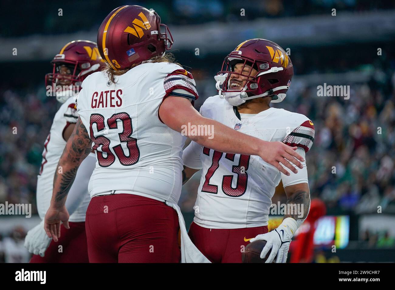 Washington Commanders running back Chris Rodriguez Jr. (23) and center ...