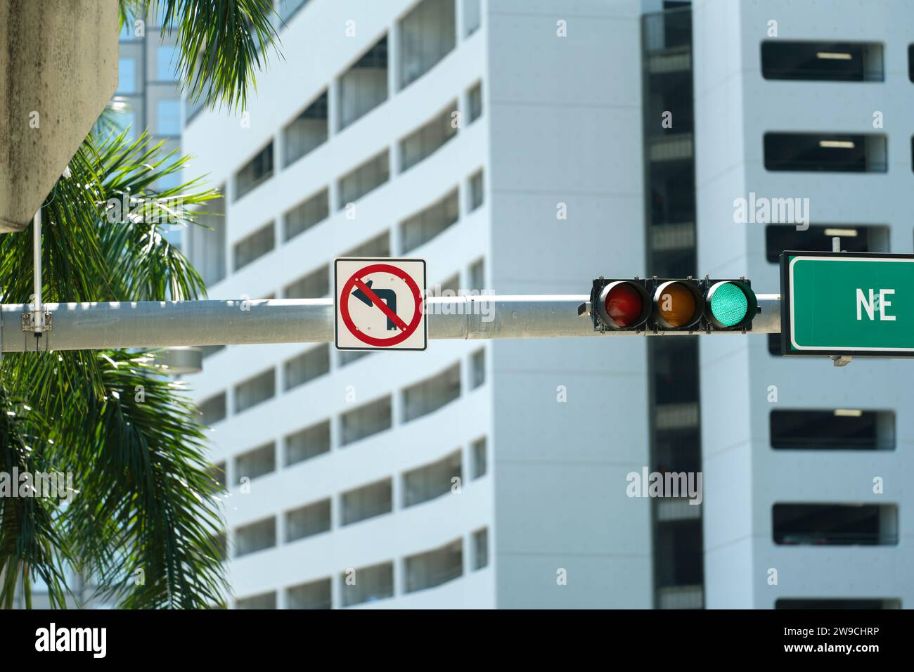 Traffic lights regulating driving cars on city street in Miami, Florida ...