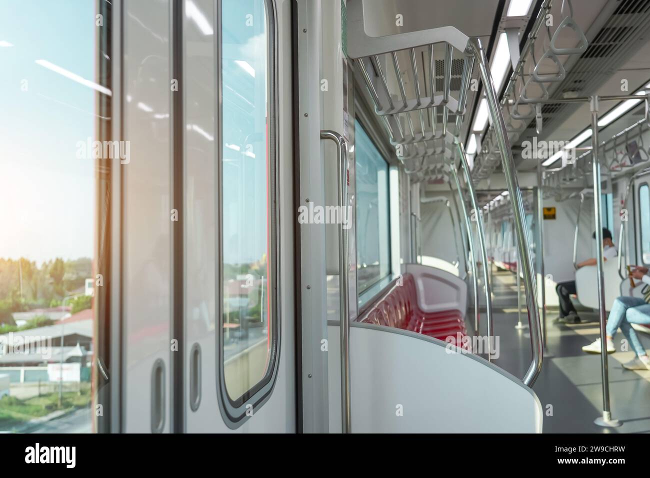 Entrance door, subway train carriage, interior with red seats and ...