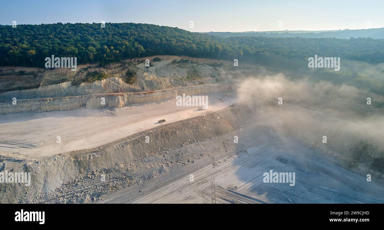 Aerial view of open pit mining site of limestone materials extraction ...